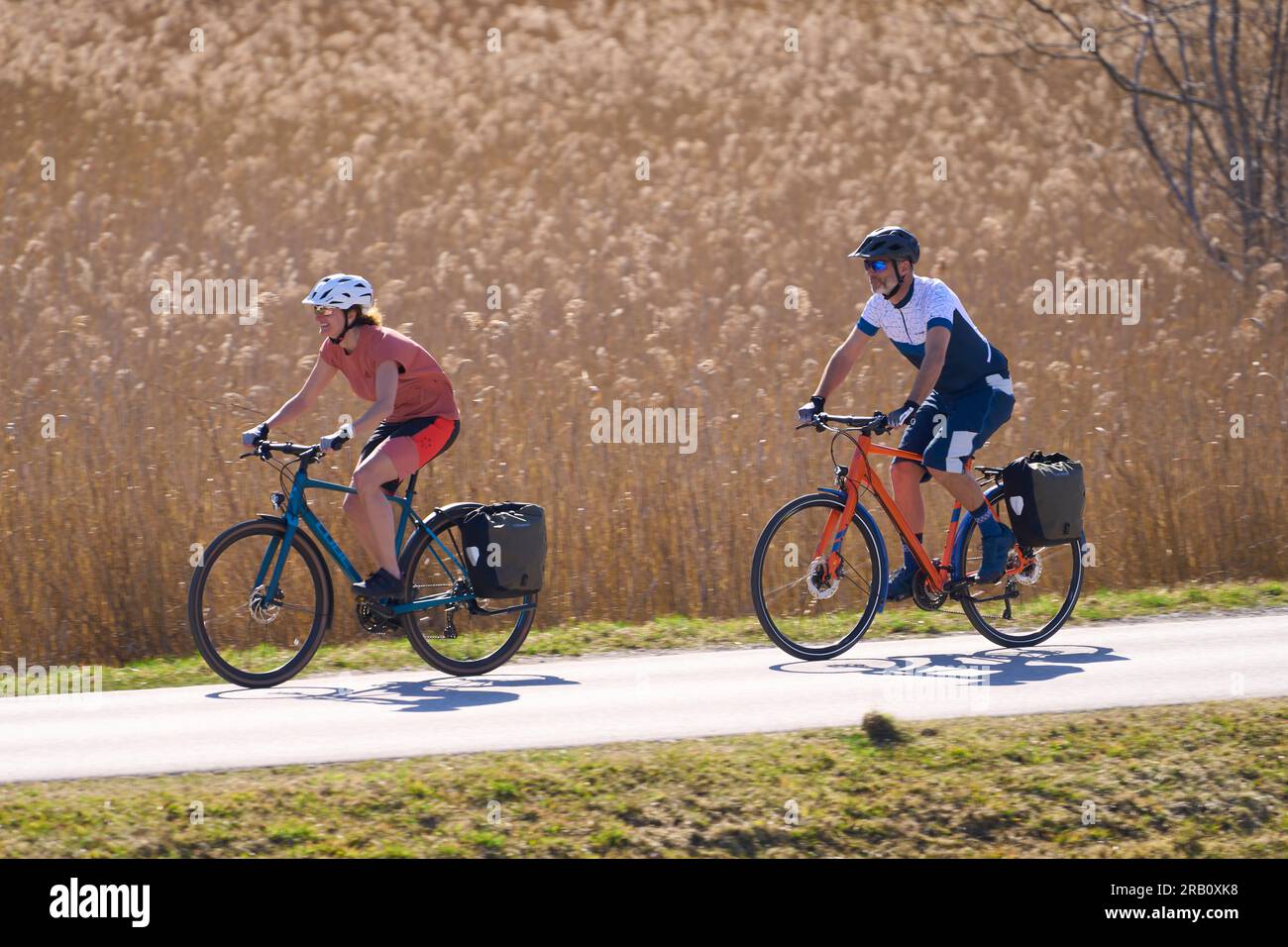 Couple, man and woman touring with bicycles, trekking bike Stock Photo ...