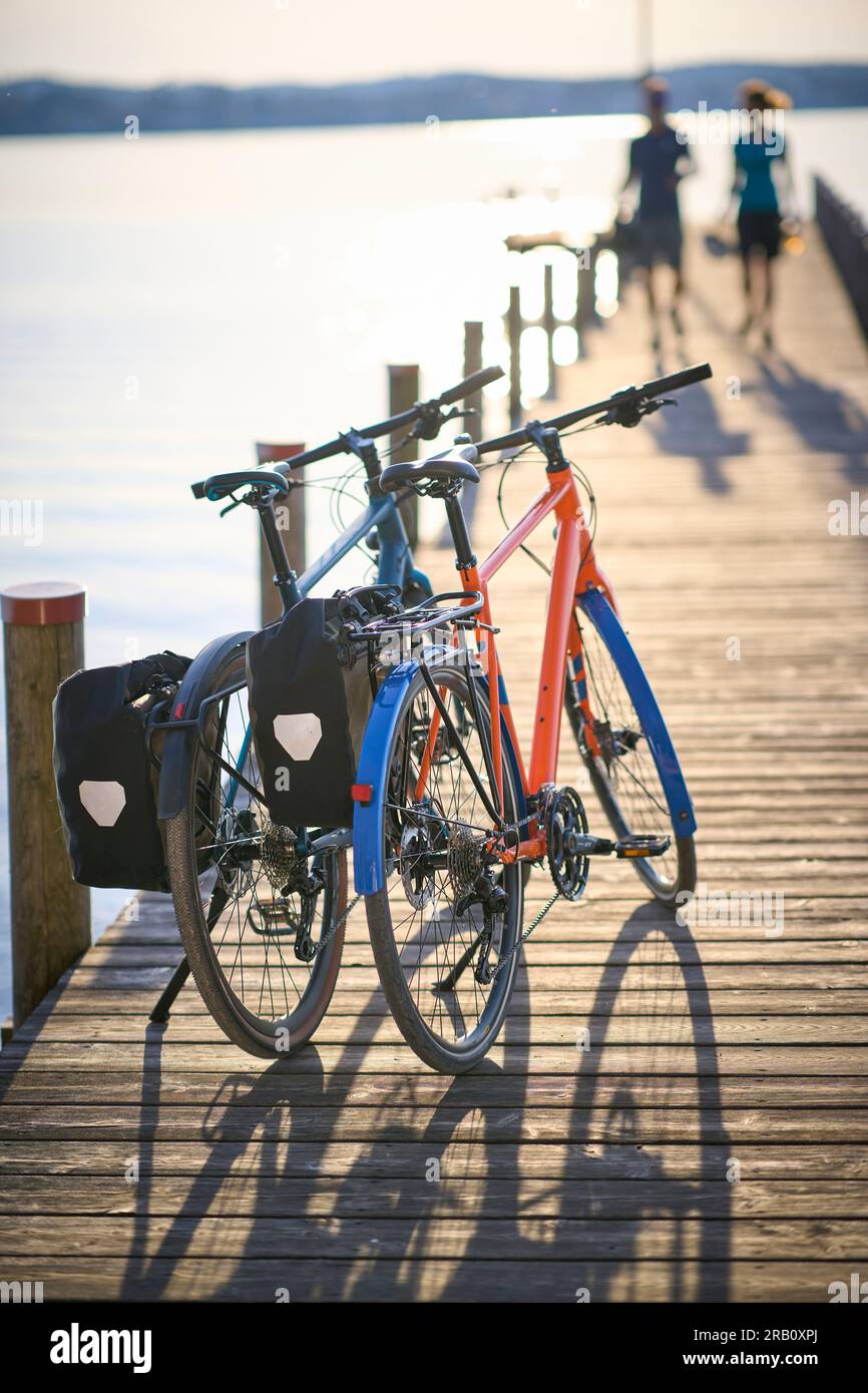 Couple, man and woman touring with bicycles, trekking bike, resting on ...