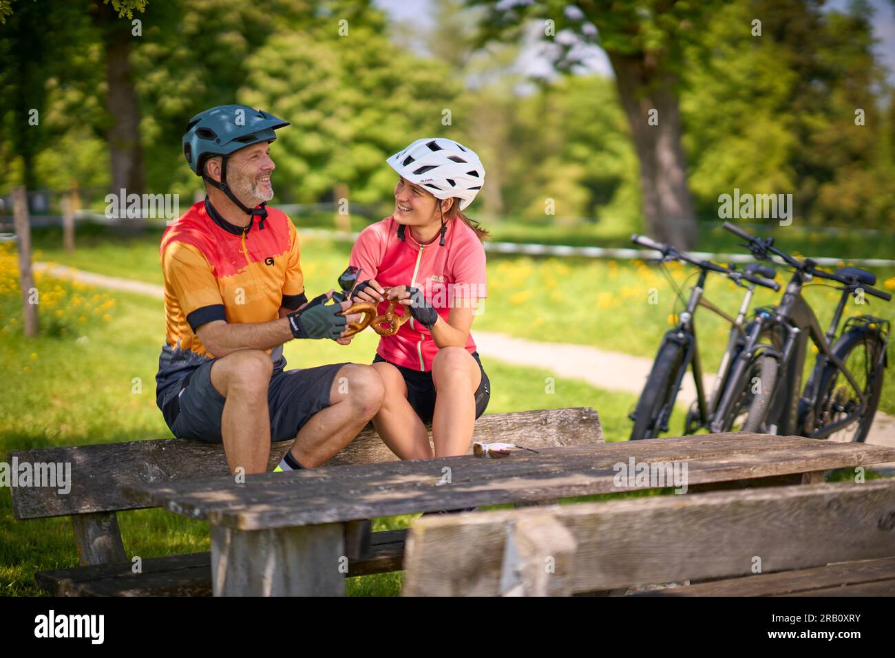 Couple, man and woman touring with bikes, rest, break, trekking bike, e ...