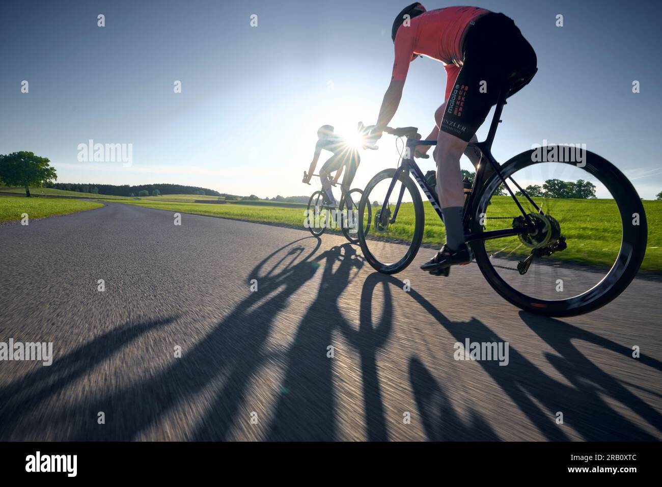 Two men on bike hi-res stock photography and images - Alamy