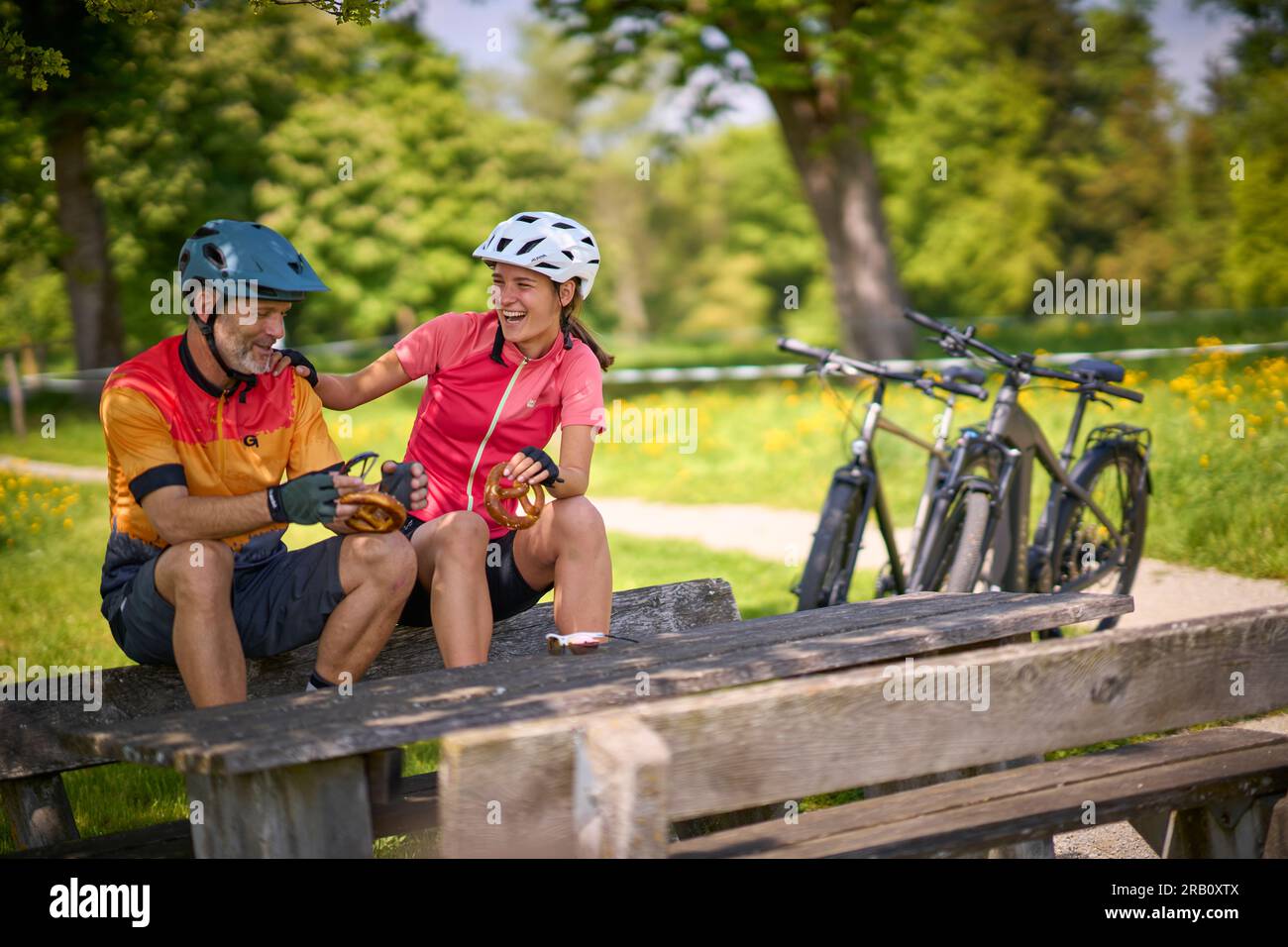 Couple, man and woman touring with bikes, rest, break, trekking bike, e ...