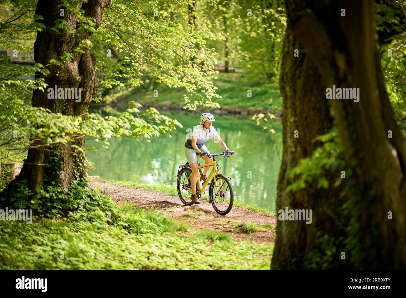 Woman touring with bike, trekking bike, travel bike Stock Photo - Alamy