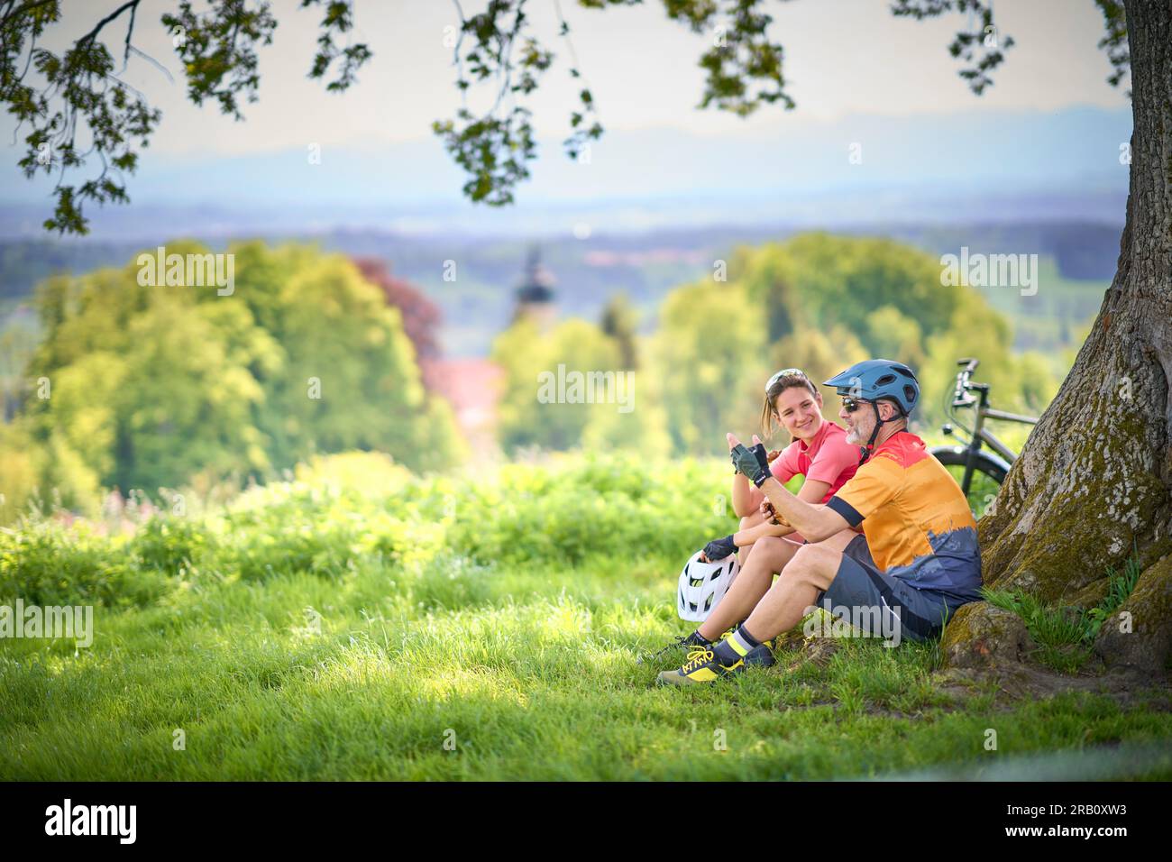 Couple, man and woman touring with bikes, rest, break, trekking bike, e ...