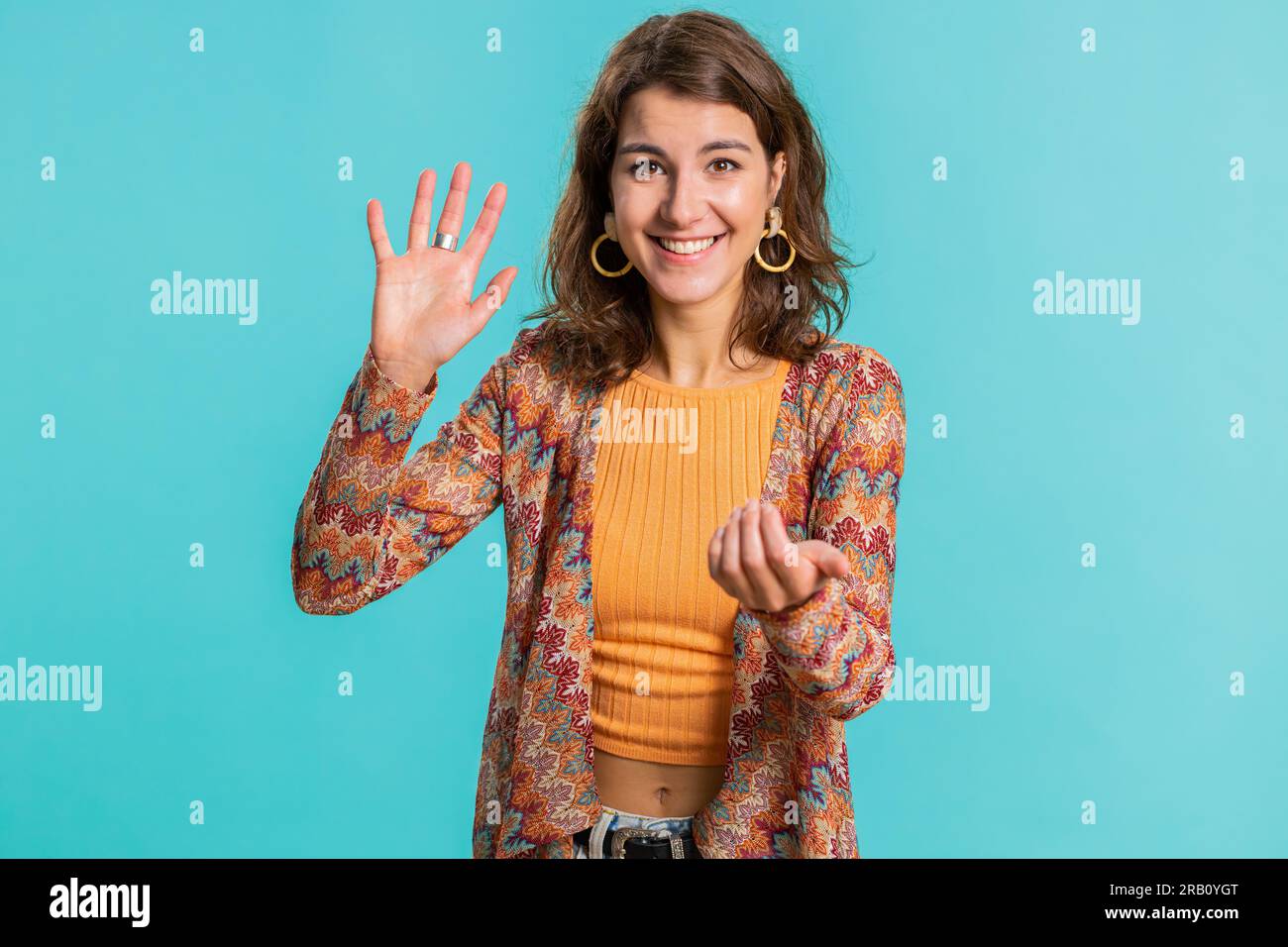 Come here, join us. Welcome. Brunette attractive woman showing inviting ...