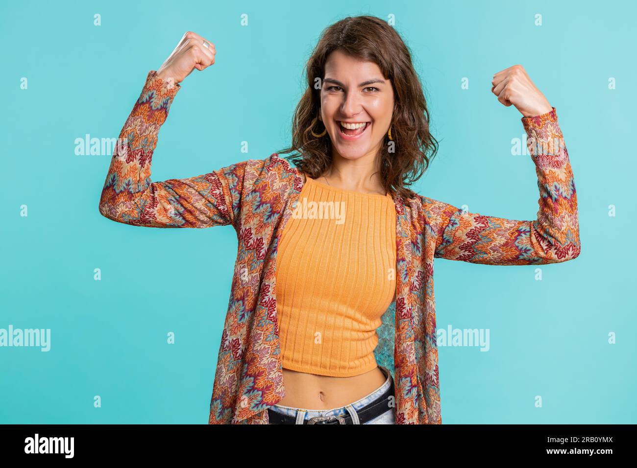 I am strong and independent. Young woman showing biceps and looking ...