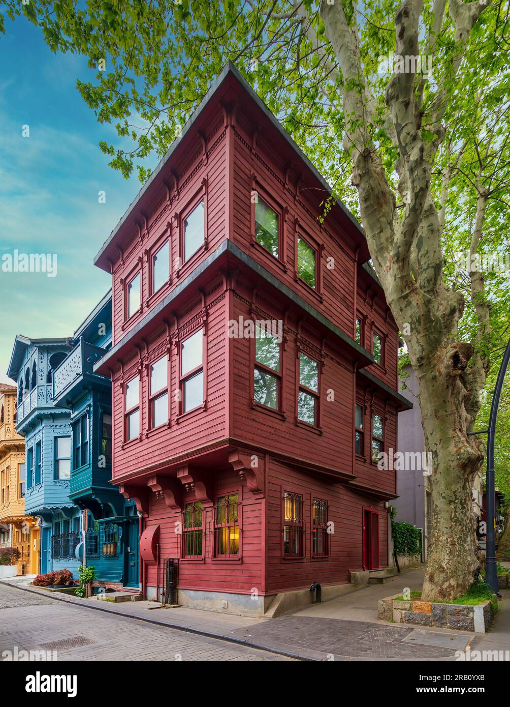 Facade of colorful wooden residential buildings painted in red and blue ...