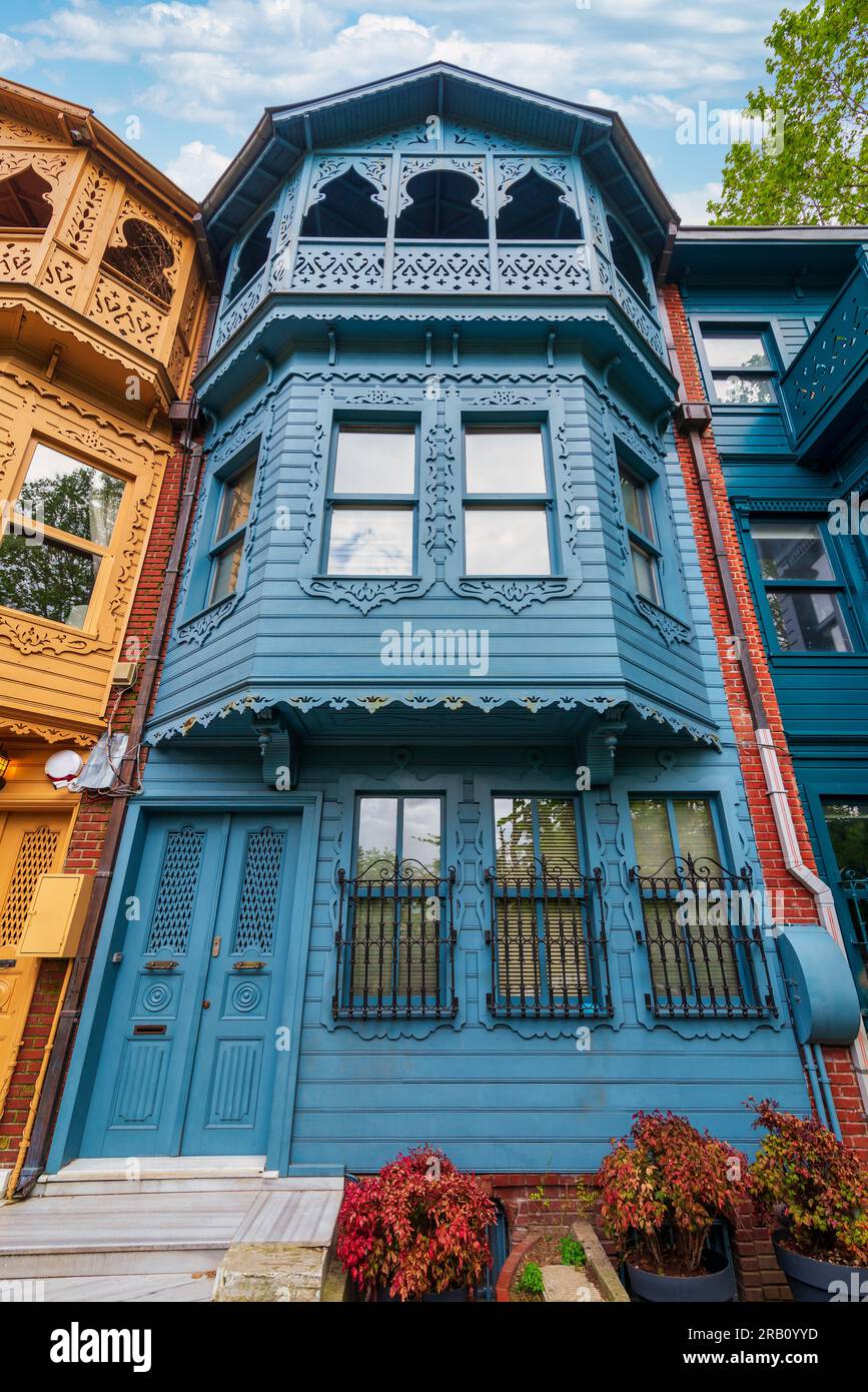 Facade of colorful wooden residential building painted in blue, with ...