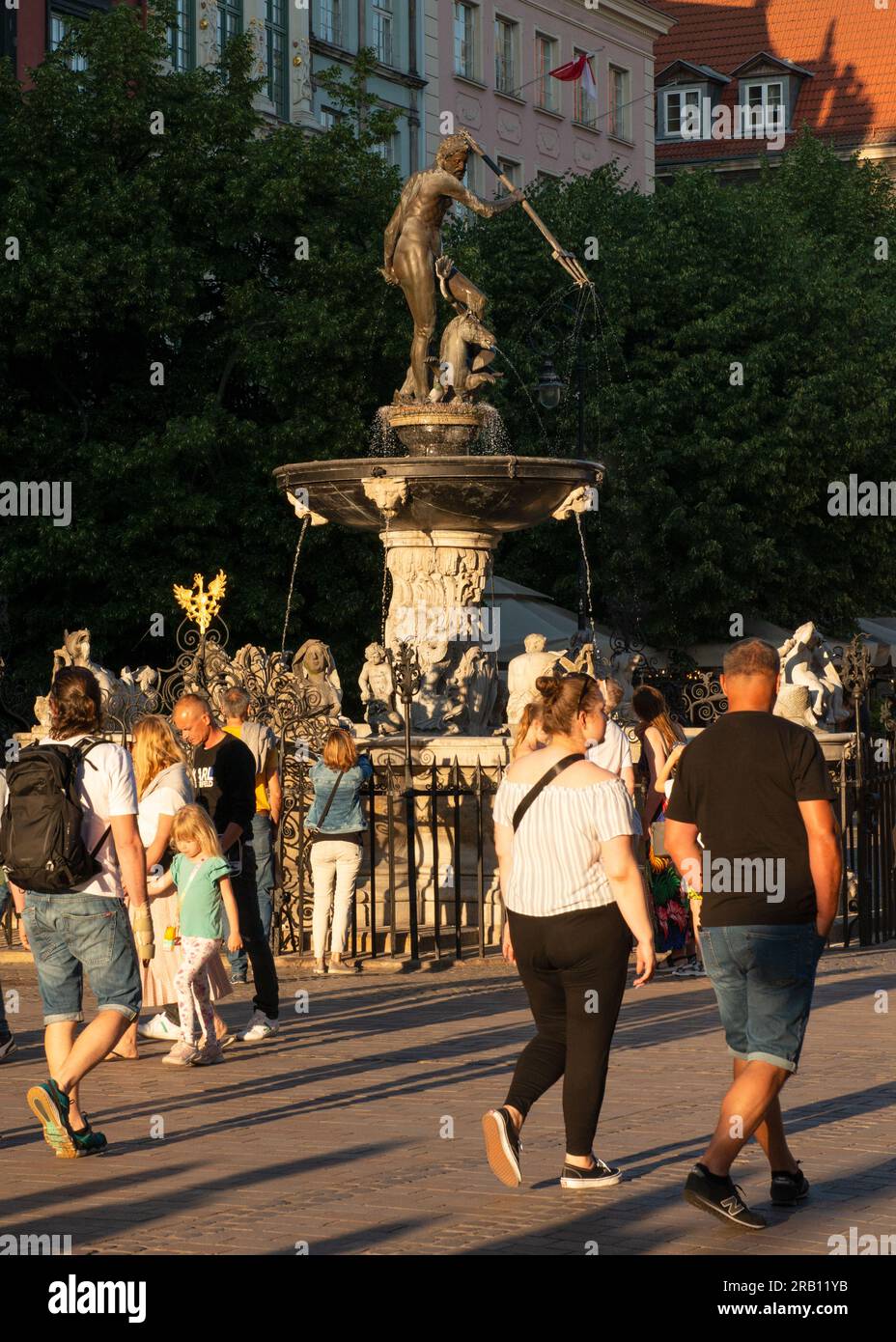 Tourists at the Neptune's fountain and statue as sightseeing landmark ...