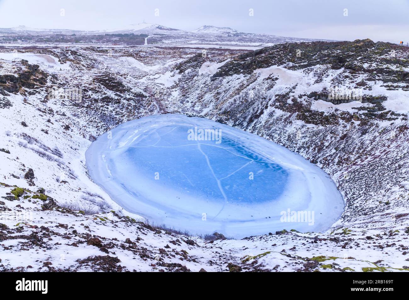 frozen crater lake of Kerid volcano Stock Photo - Alamy