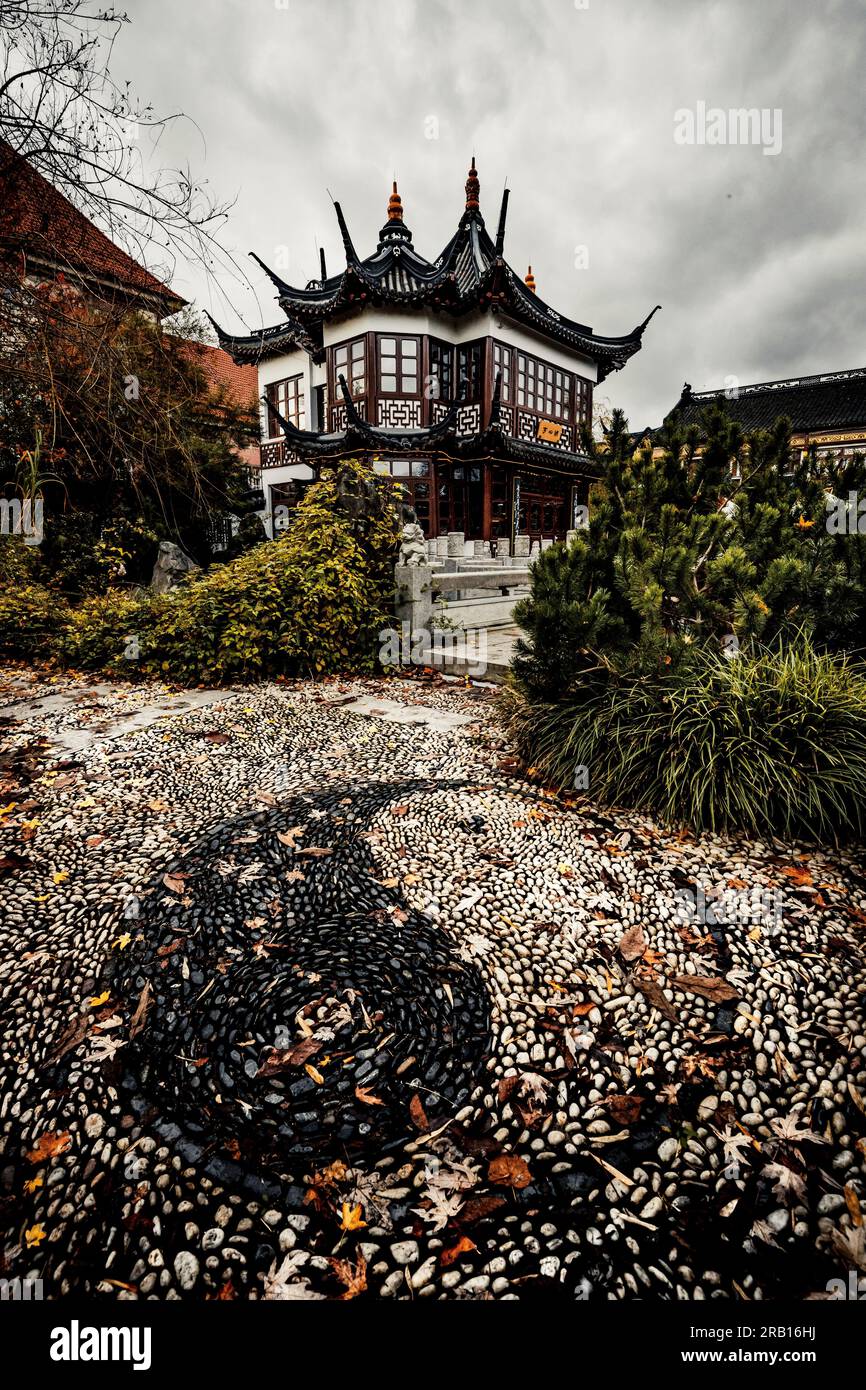 China in Hamburg, Chinese garden, park with buildings un Ying Yang sign ...