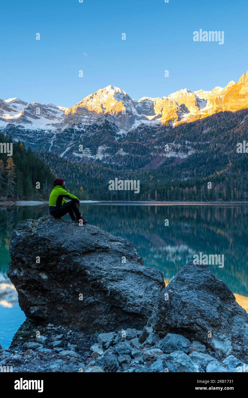tourist admiring Tovel lake, Europe, Italy, Trentino South Tyrol ...