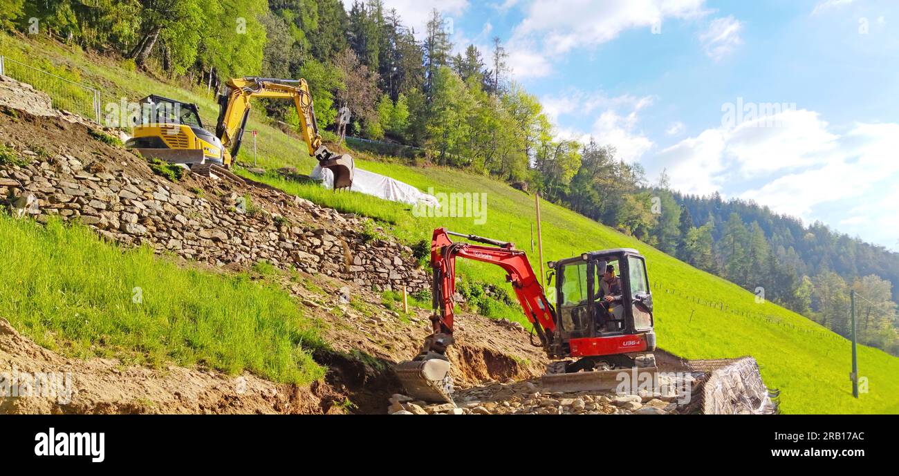 Construction work on the steep slope for a new farmhouse, Ulten Valley ...