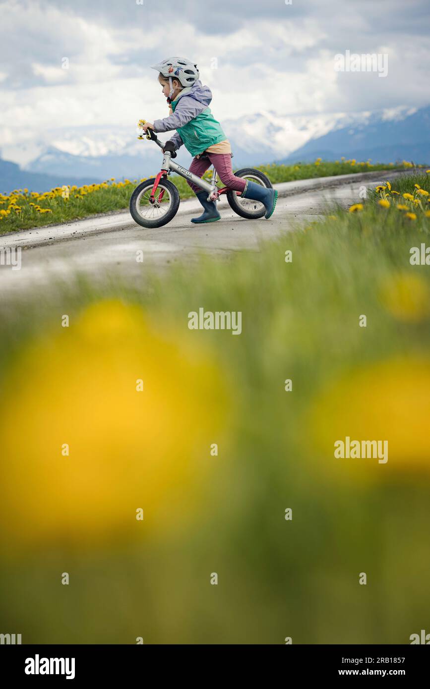 Little girl with running wheel Stock Photo - Alamy Little girl with running wheel Stock Photo - Alamy