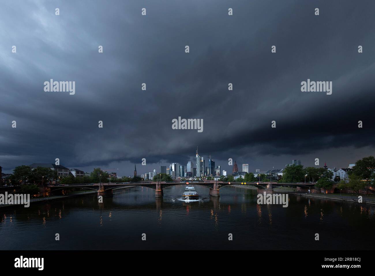 The thundercloud is directly above the skyline hi-res stock photography ...