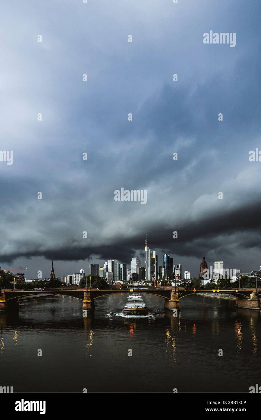 The thundercloud is directly above the skyline hi-res stock photography ...