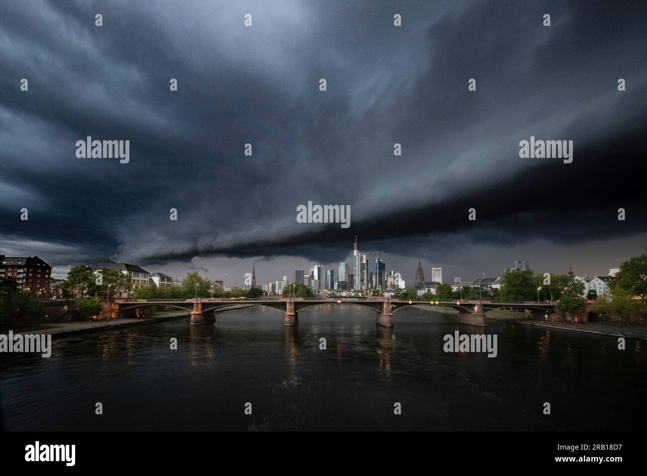 The thundercloud is directly above the skyline hi-res stock photography ...
