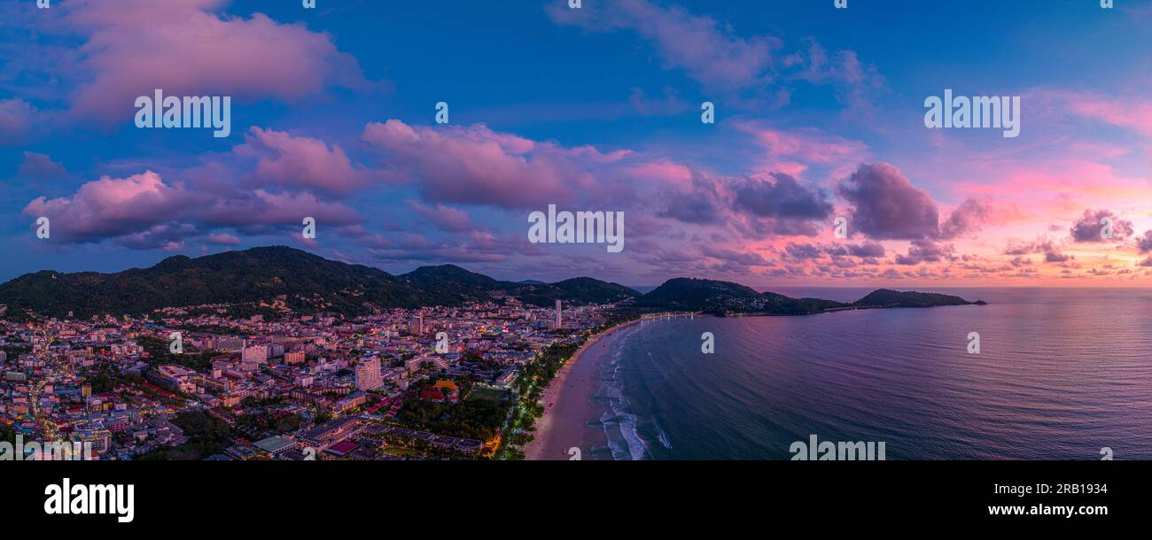 Aerial panorama view scene romantic pink sky on sunset at Patong beach ...