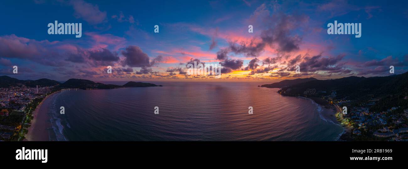Aerial panorama view scene romantic pink sky on sunset at Patong beach ...