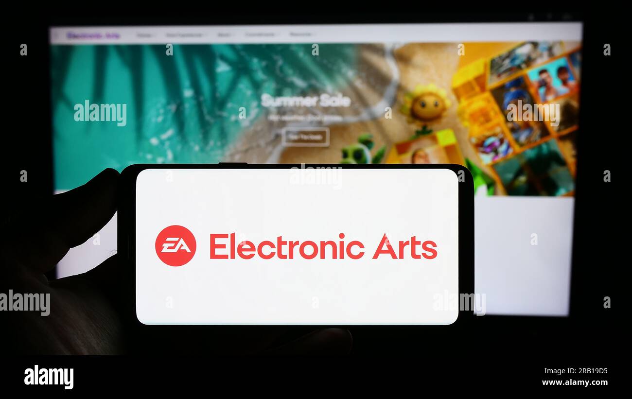 Person holding smartphone with logo of video game company Electronic ...