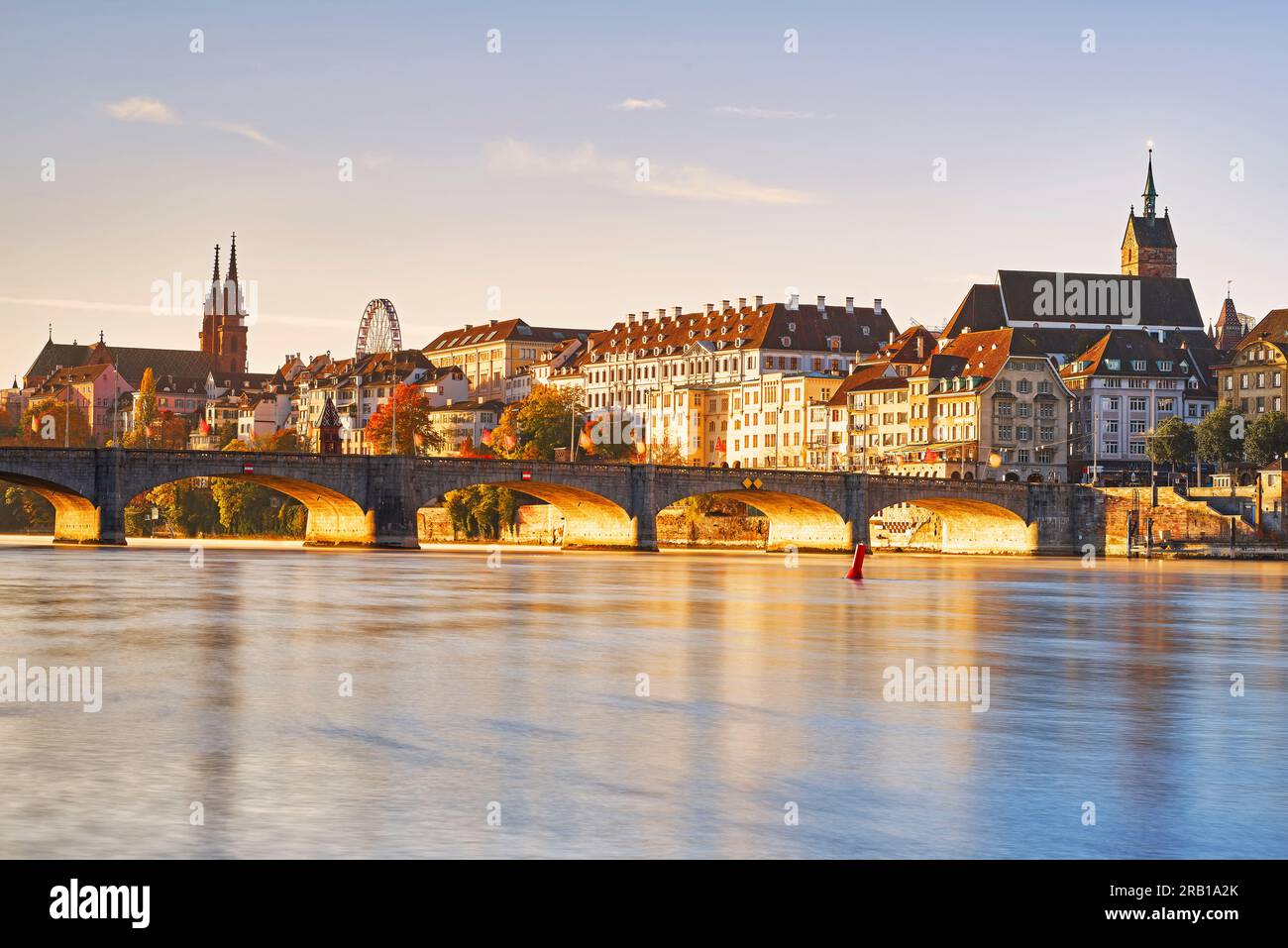 Early morning in Basel at the middle bridge, the arches of which are ...