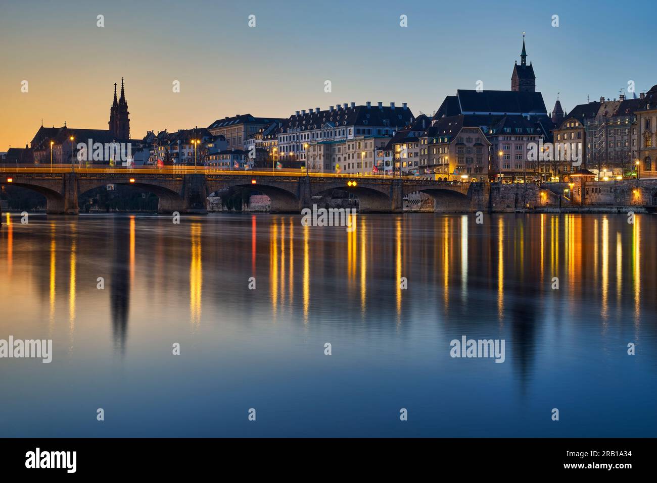 Early morning in Basel at the middle bridge, the arches of which are ...