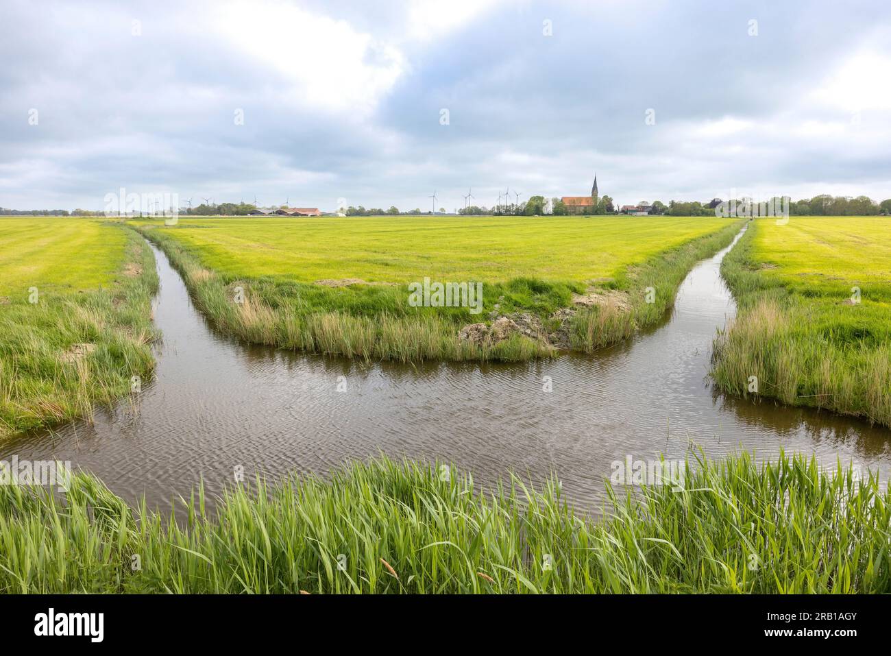 View over grassland and drainage canals to Langwarden in Budjadingen ...