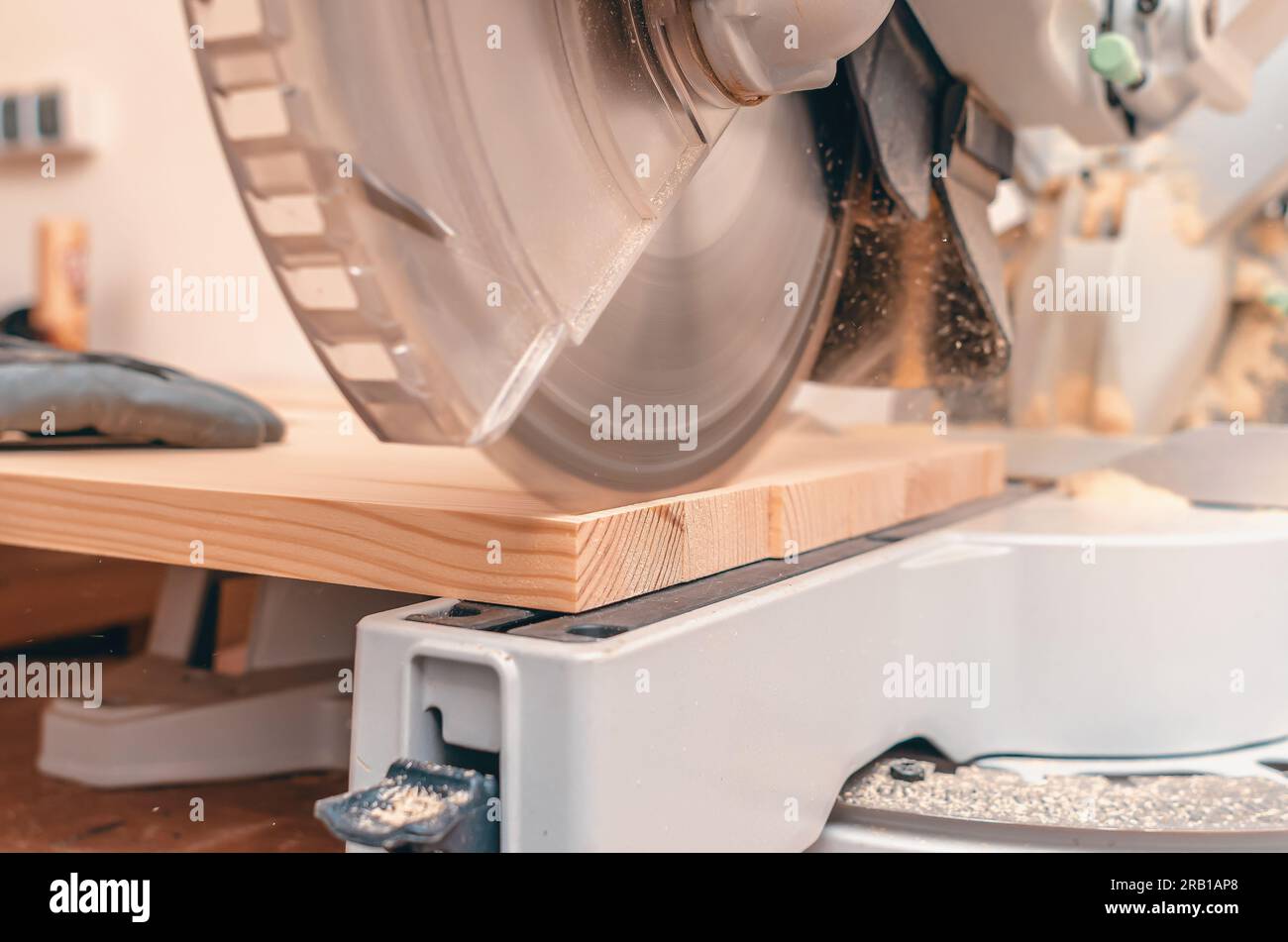 Modern circular machine for cutting wooden boards. Cutting process ...