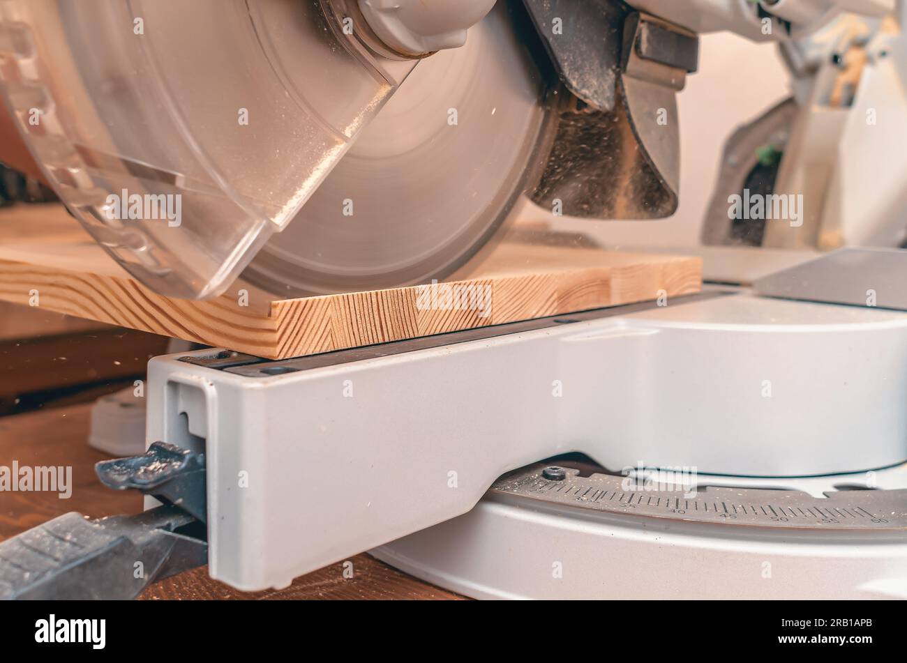 Modern circular machine for cutting wooden boards. Cutting process ...