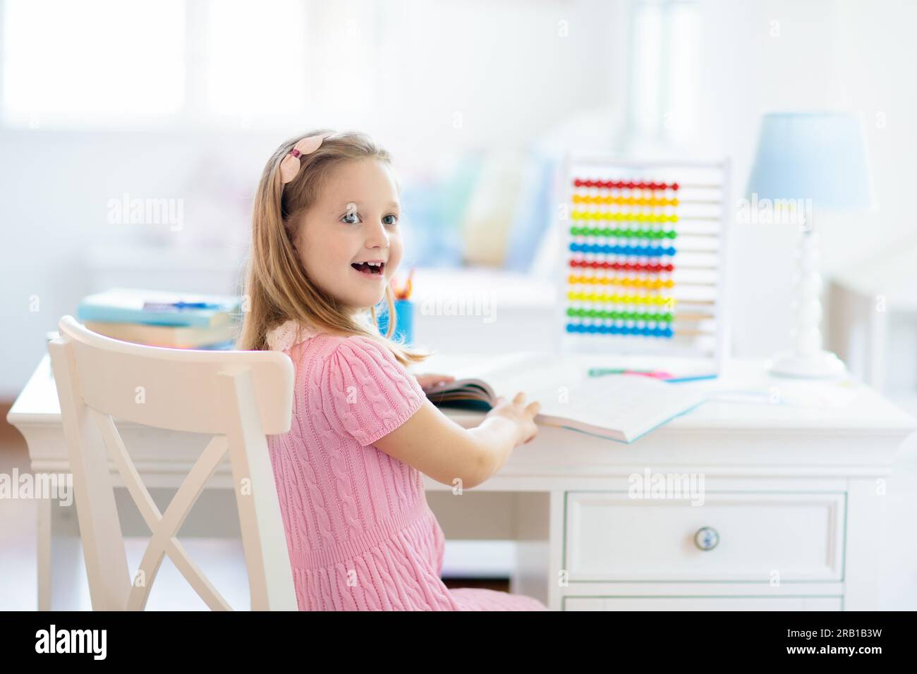 Child doing homework at home. Little kid with wooden colorful abacus ...