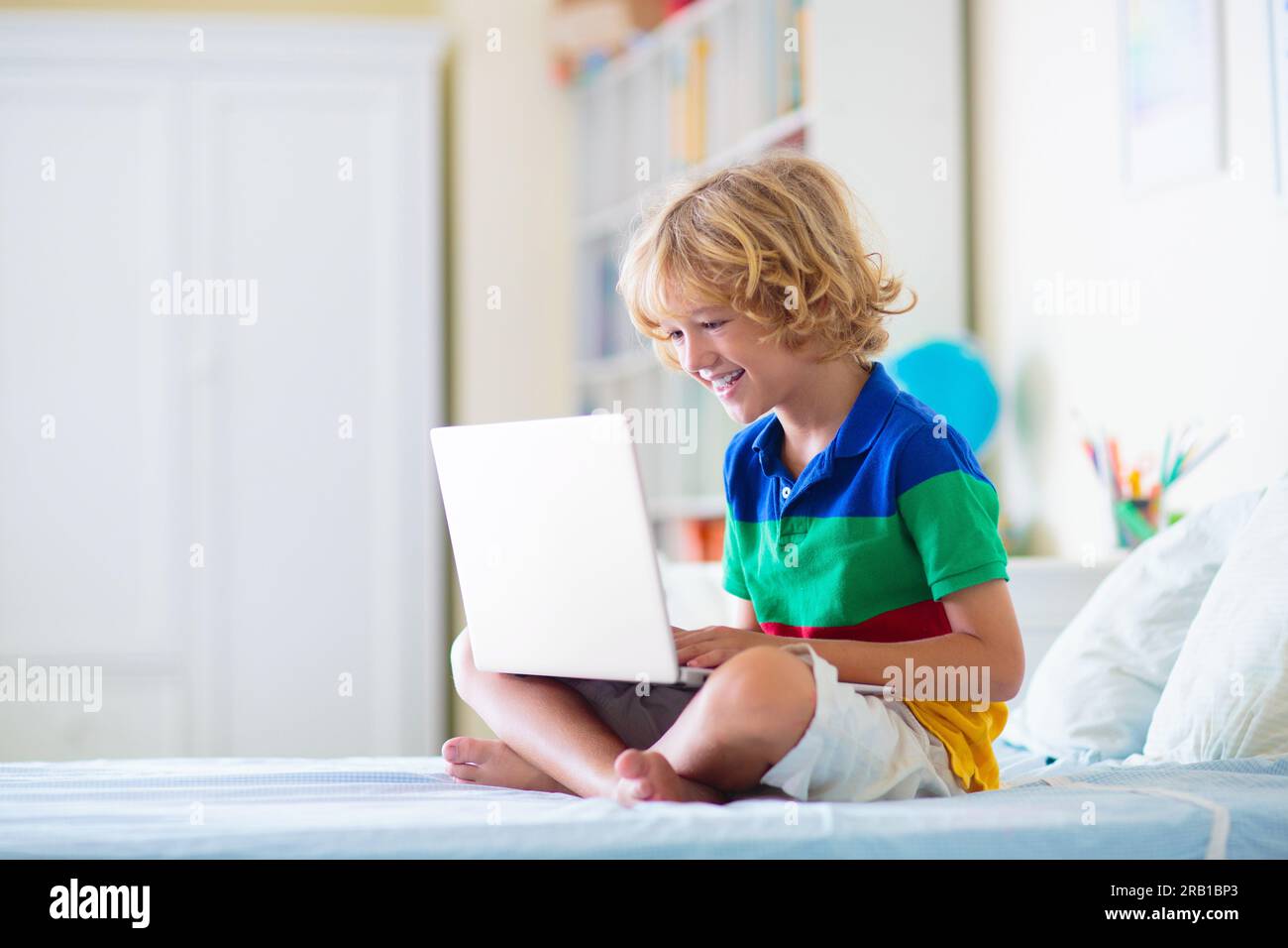 Child doing homework on computer. Online class. Homeschooling and ...