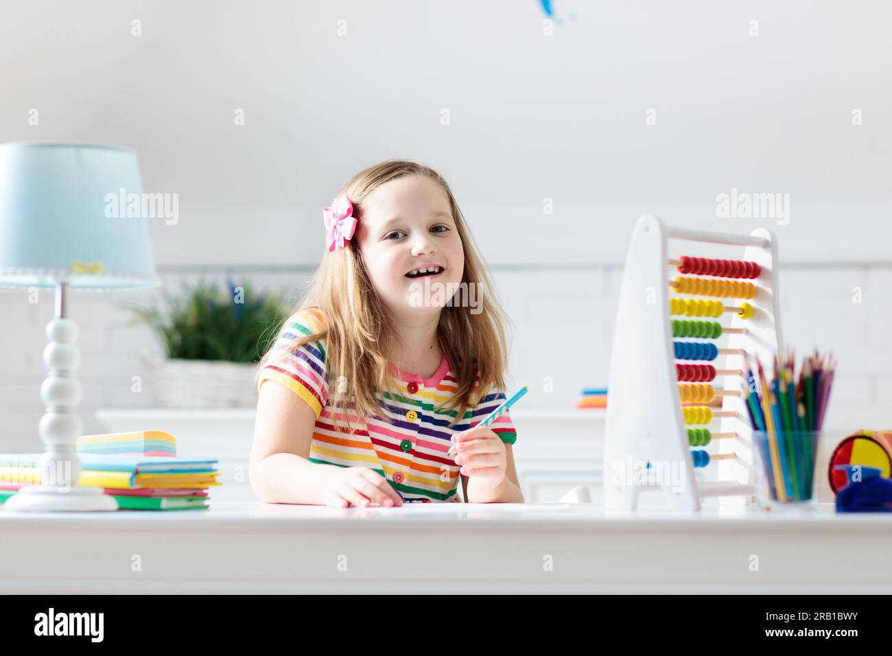 Child doing homework at home. Little kid with wooden colorful abacus ...