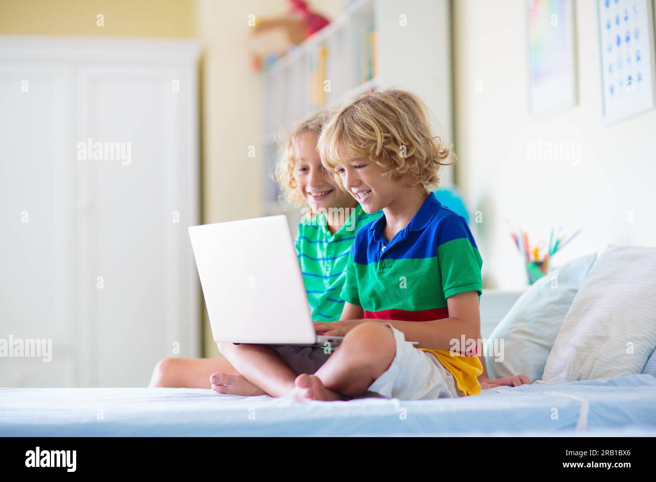 Child doing homework on computer. Online class. Homeschooling and ...