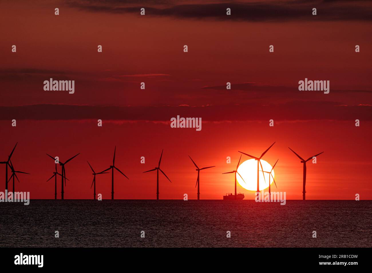 Sunset over the Burbo Bank offshore wind farm, Liverpool Bay, England ...