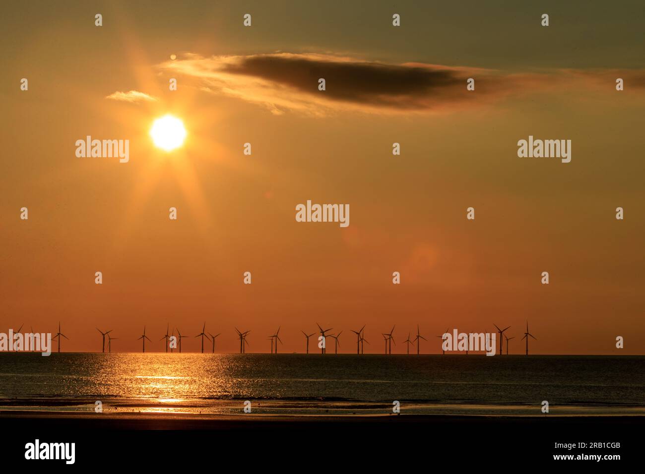 Sunset over the Burbo Bank offshore wind farm, Liverpool Bay, England ...