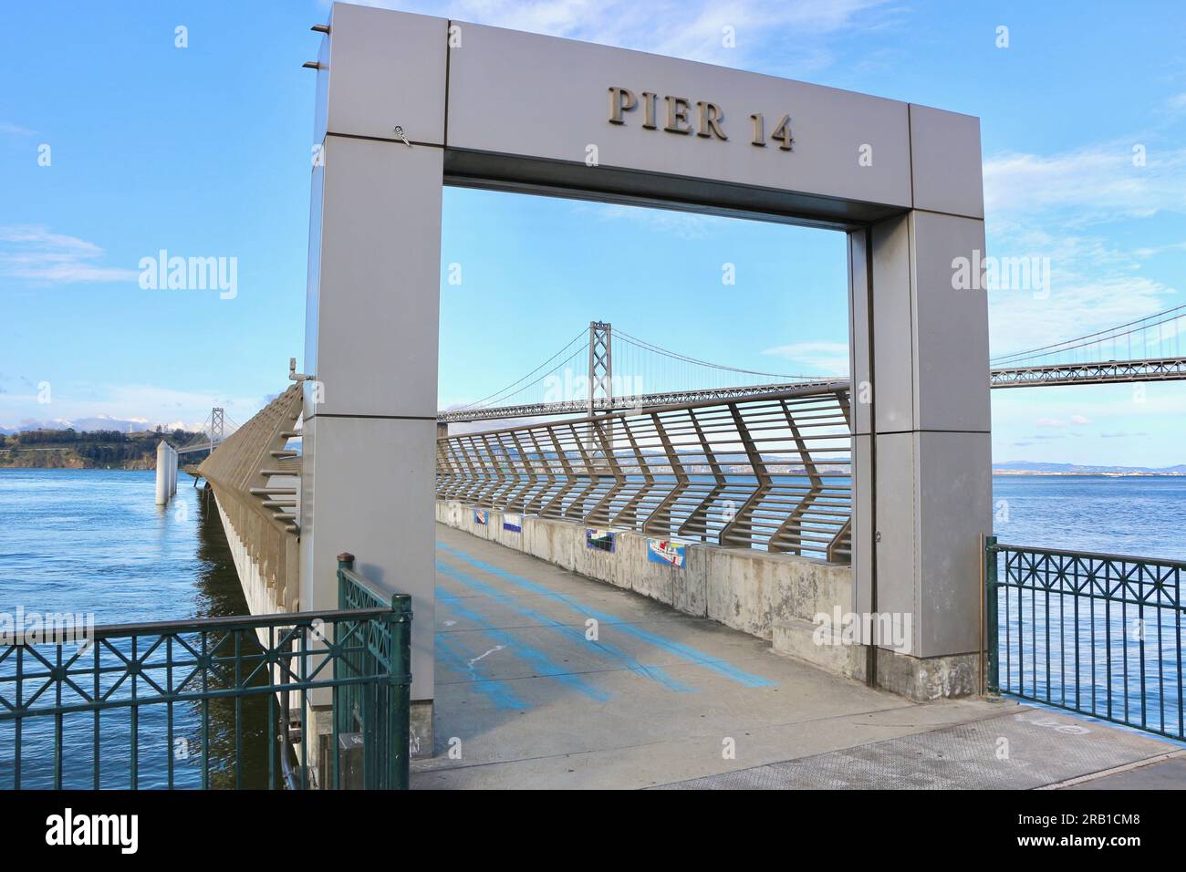 Entrance arch to Pier 14 from the Embarcadero with Bay Bridge San ...