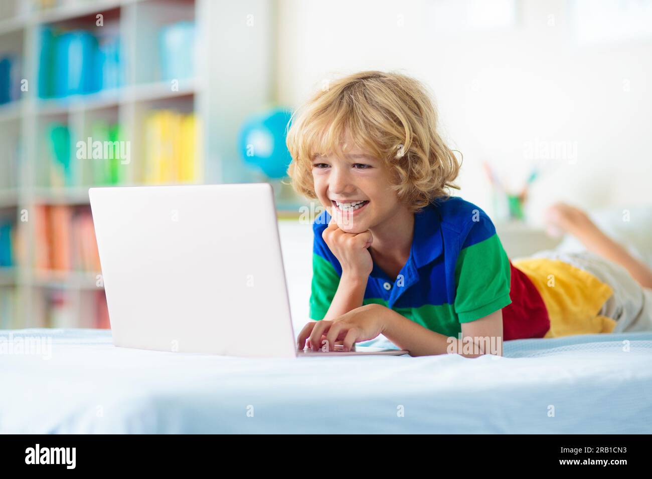 Child doing homework on computer. Online class. Homeschooling and ...