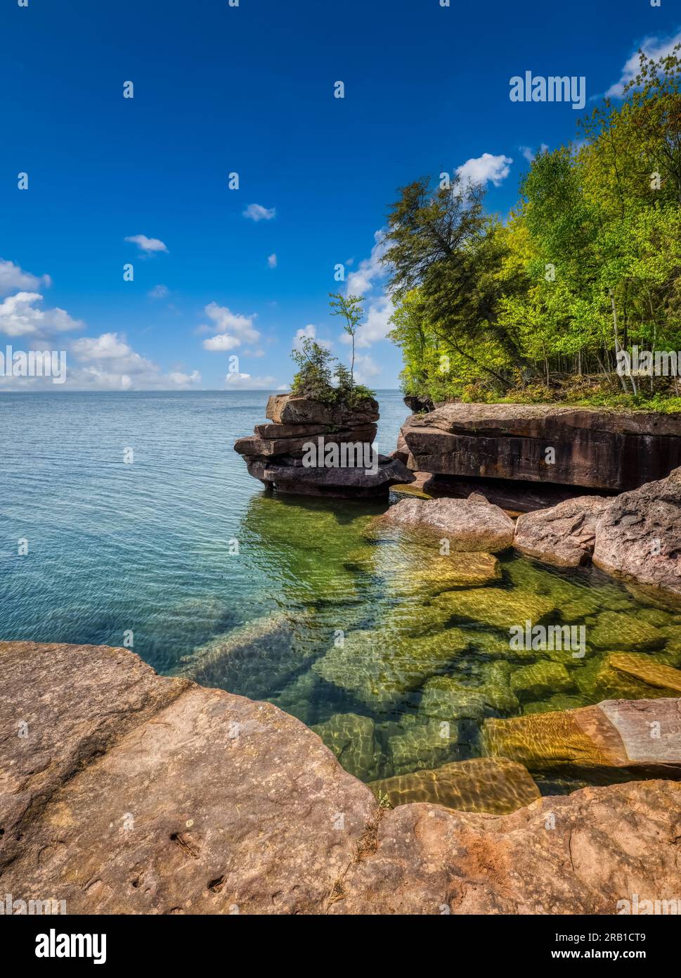 Rocky coastline of Lake Superior in Big Bay State Park in La Pointe on ...