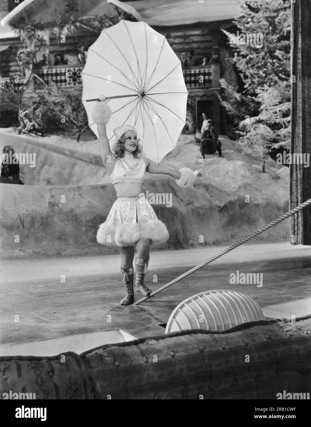 United States: c. 1933 A young woman performer prepares to walk a ...