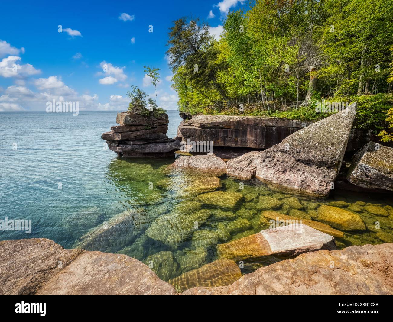 Rocky coastline of Lake Superior in Big Bay State Park in La Pointe on ...