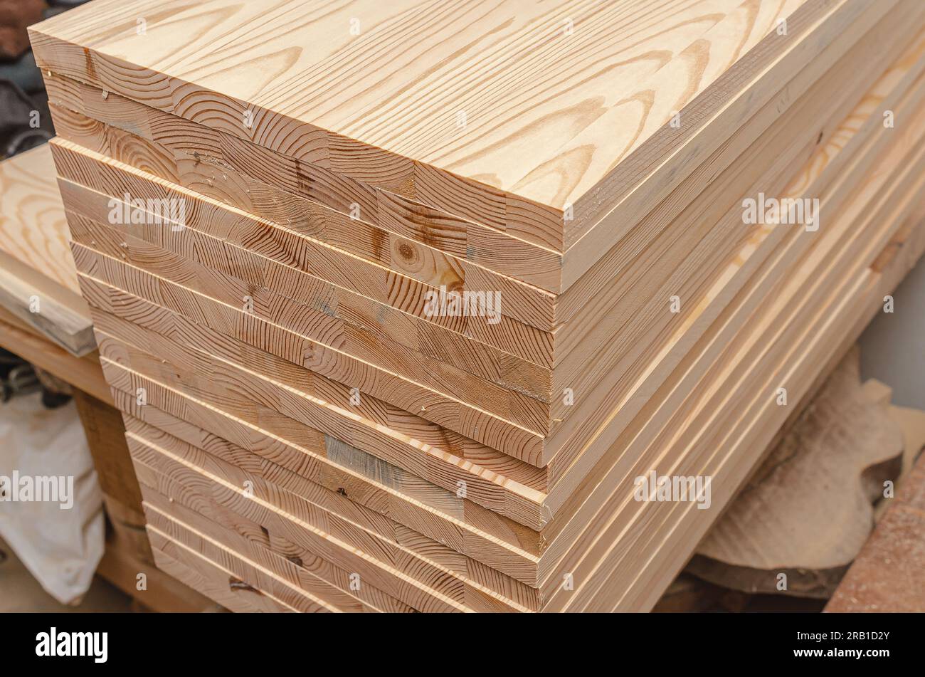 Sawn wooden boards stacked in production workshop. Carpenter Stock ...