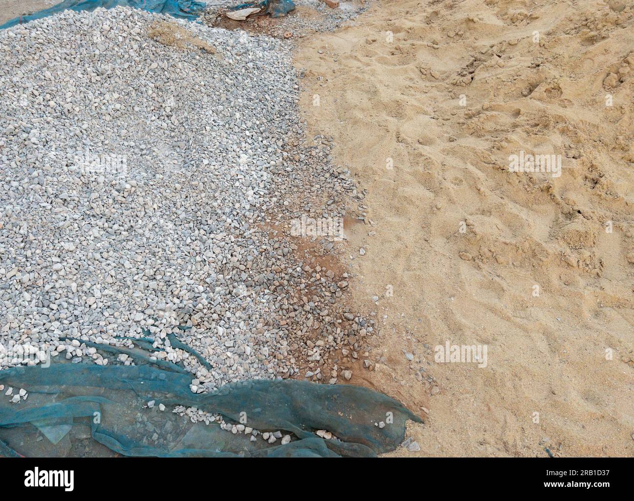The stone and sand pile on the blue canvas sieve for mixing cement in ...