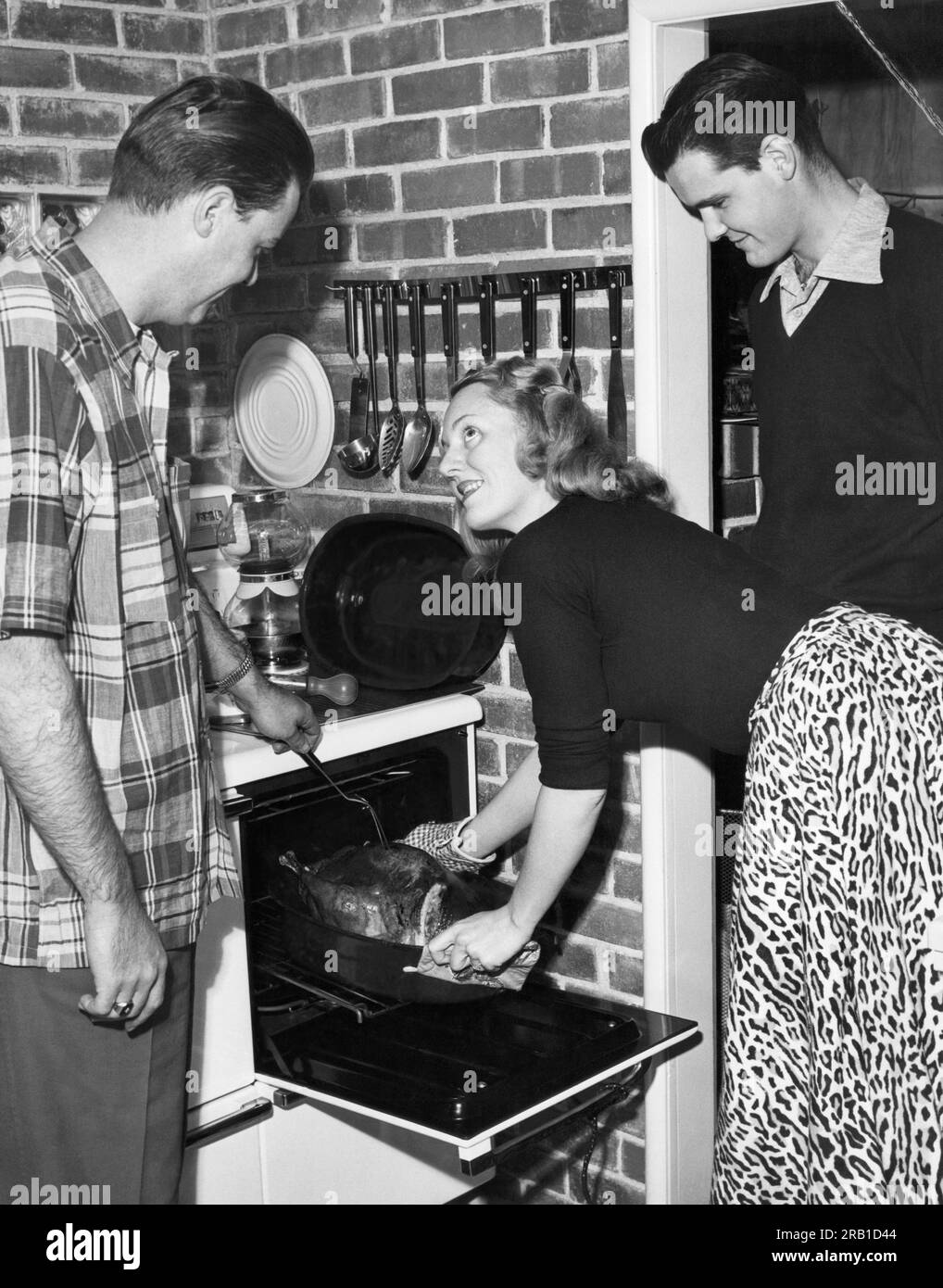 Manlo Park, California: November, 1952 A woman checking on a ...