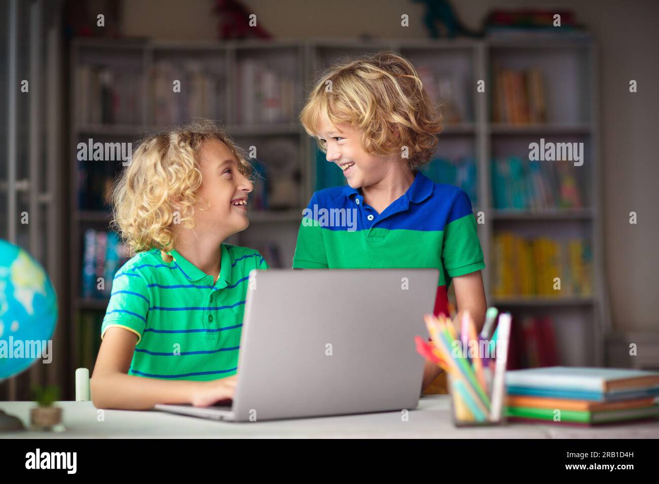 Child doing homework on computer. Online class. Homeschooling and ...