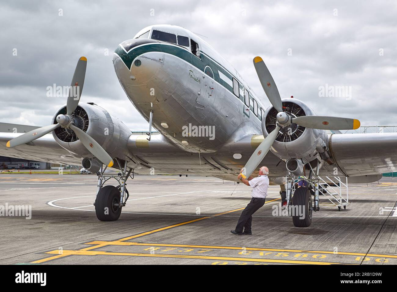DC-3 at the airport, propeller manual turn Stock Photo - Alamy