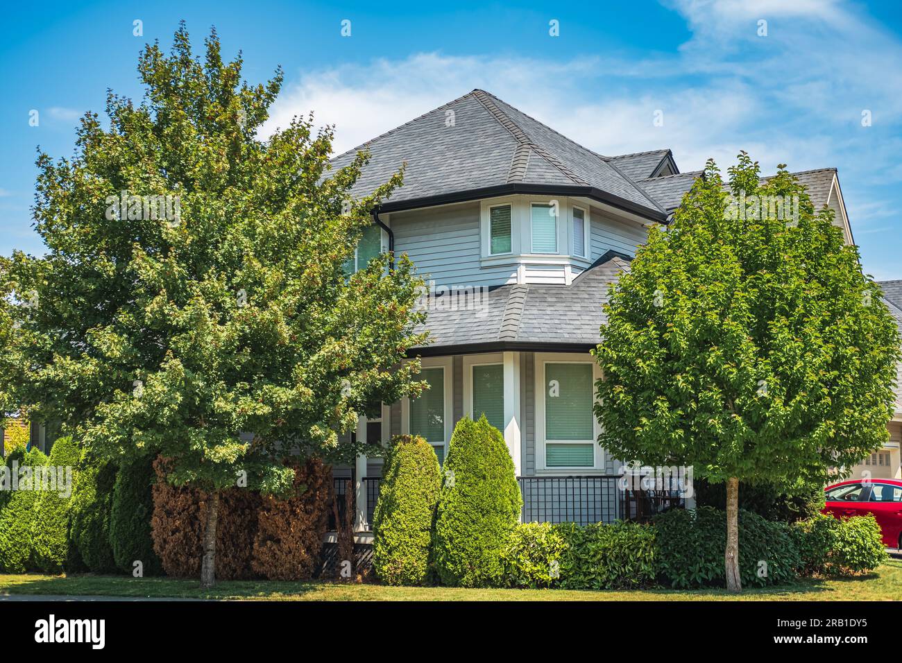 Real Estate Exterior Front House on a sunny day. Big custom made luxury ...