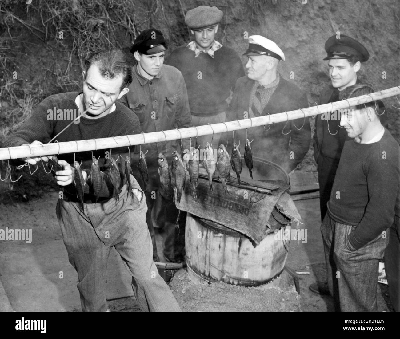 Fish preparation hands Black and White Stock Photos & Images - Alamy