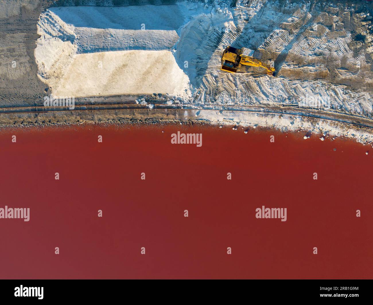 Salt farm excavator top view with salt hill Stock Photo - Alamy
