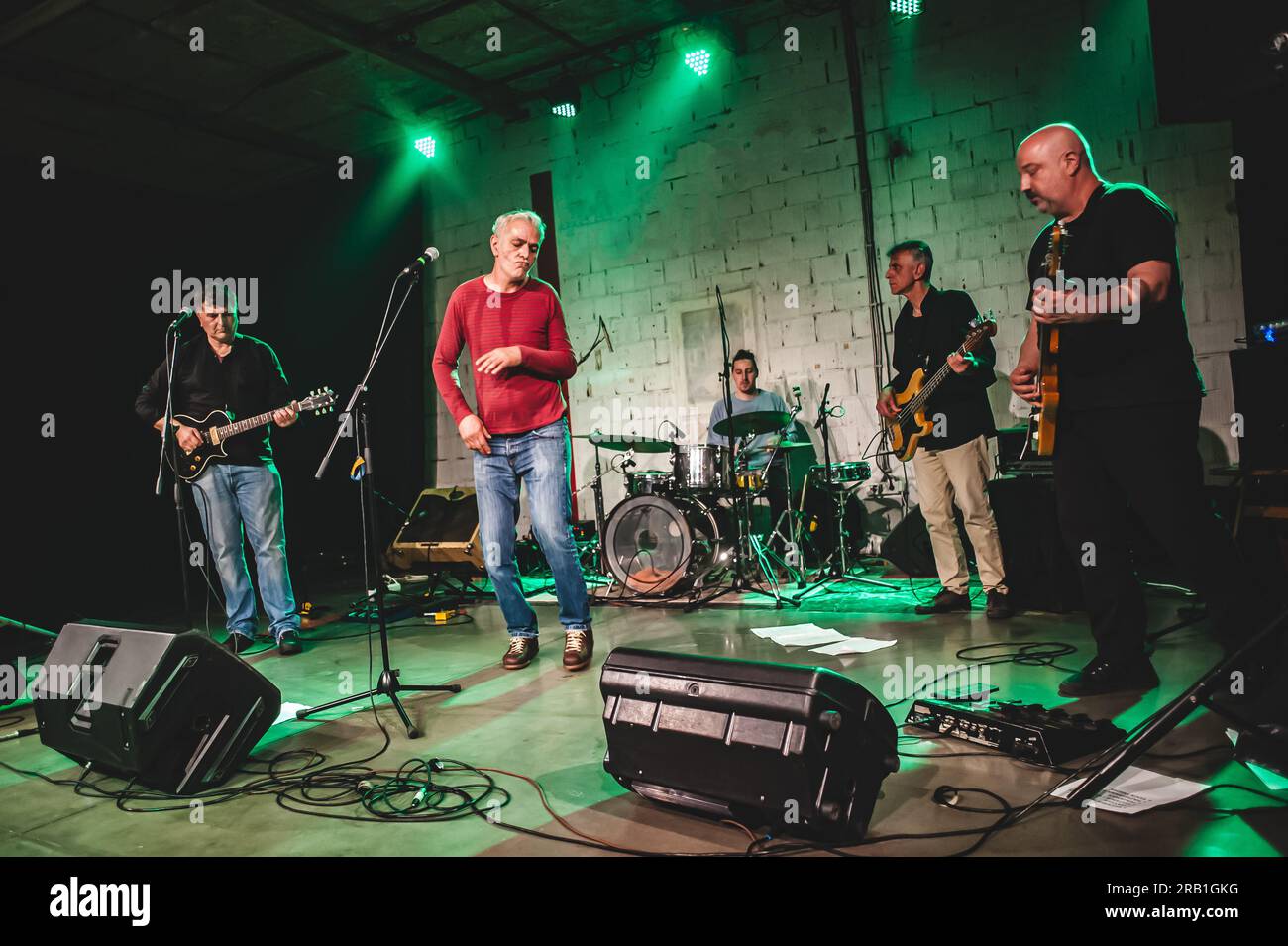 Punk rock music band group have live performance on a stage. Singer ...