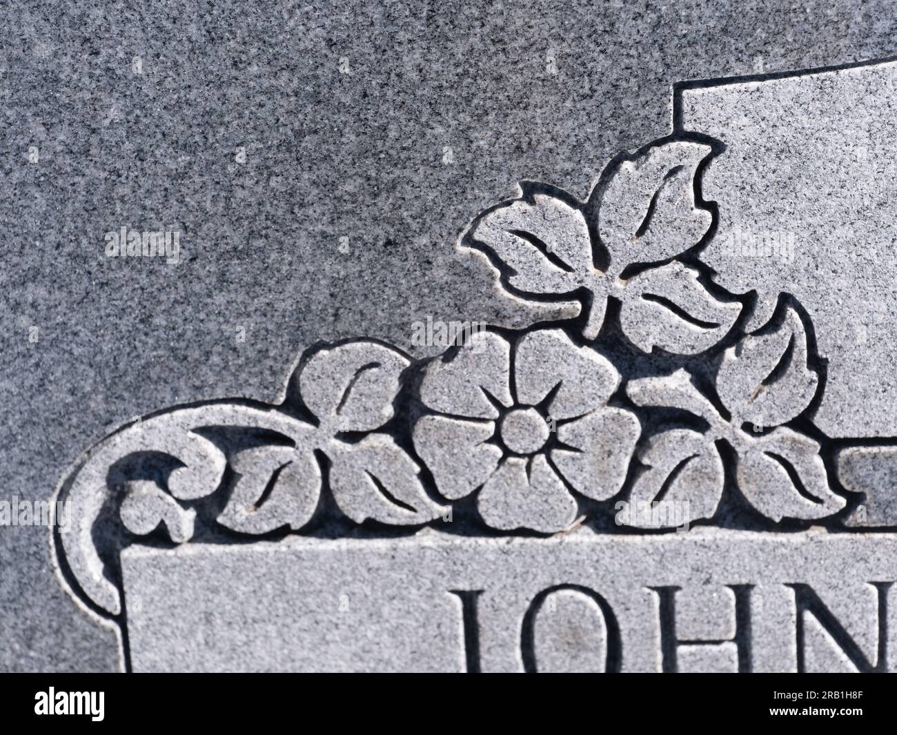 Engravings on grave stone Stock Photo - Alamy