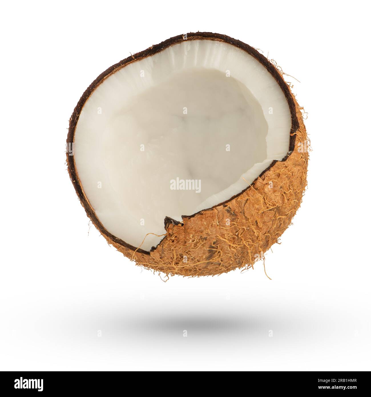 Broken coconut on a white isolated background. Half of a coconut, flesh ...